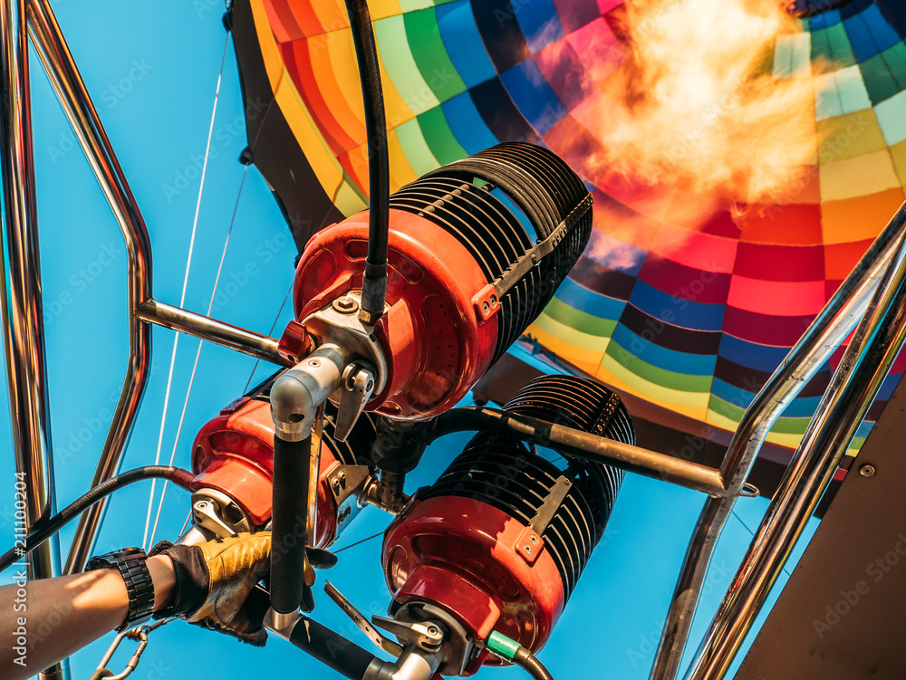 Hot air balloon, bright burning fire flame from gas burner equipment ...