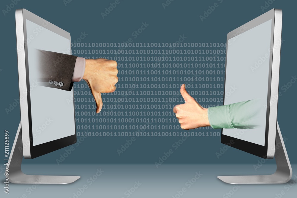 like and dislike concept, two hands from monitors. thumbs down, dislike ...