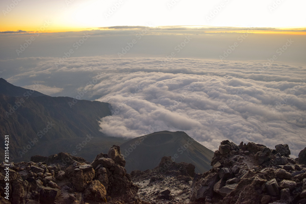 Golden sunrise above the clouds at Mount Meru, Arusha National Park ...