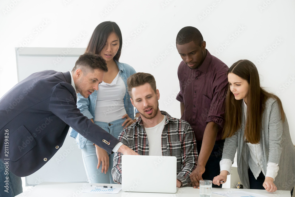 Diverse millennial work team working together on online project ...