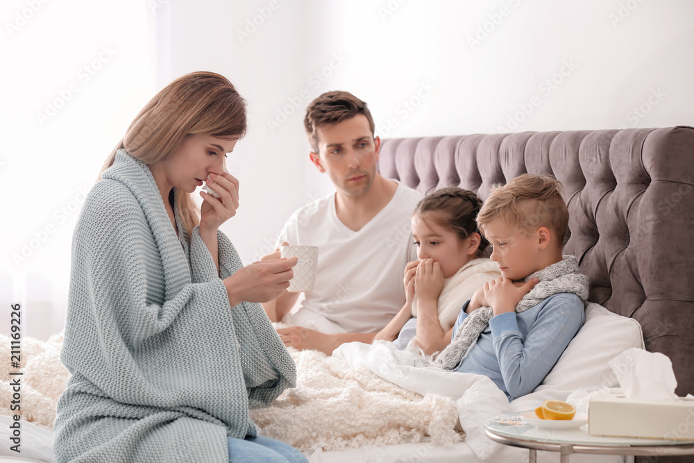 Whole family suffering from cold at home Stock Photo | Adobe Stock