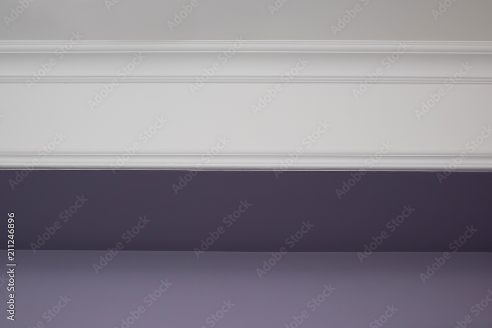Ceiling moldings in the interior, details of an even edge of the ...