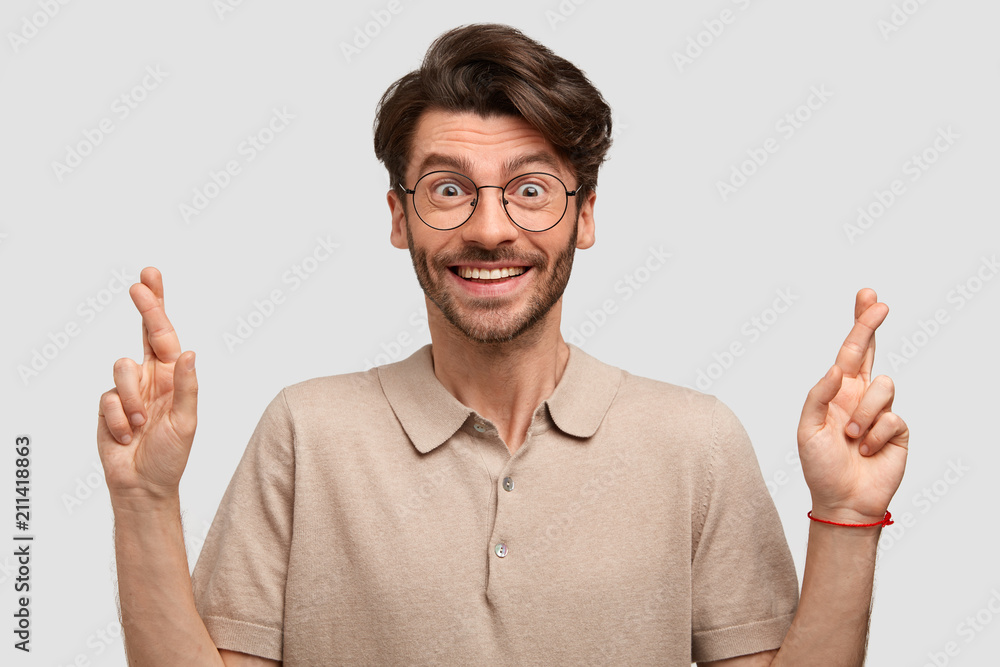 Body language and positive emotions concept. Cheerful bearded young ...