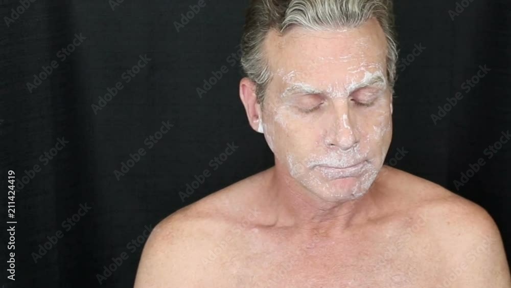 Vídeo do Stock: Man with thin white bentonite clay face mask turning ...