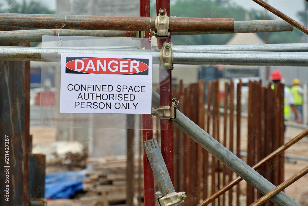 Safety signage "Authorized Personnel Only" at the construction site ...