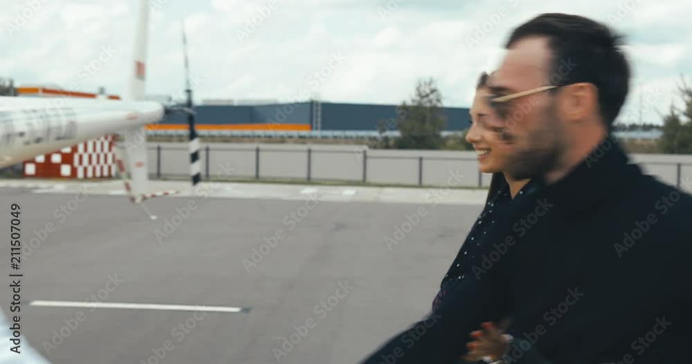 TRACKING commercial pilot in uniform greeting clients near small ...