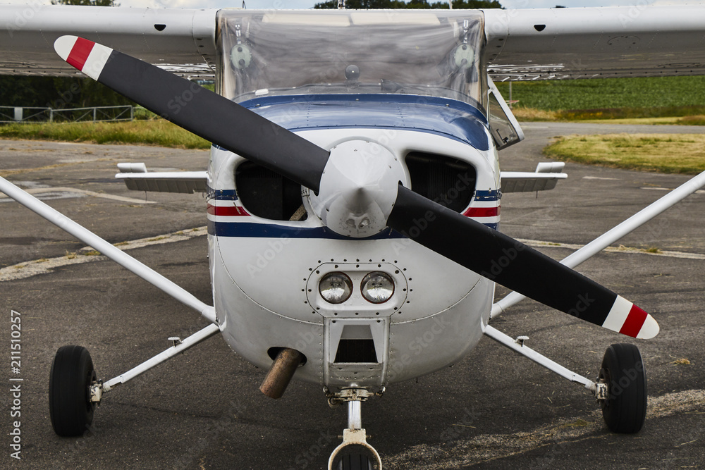 Symmetrical front view of Cessna 172 Skyhawk 2 airplane on an asphalt ...