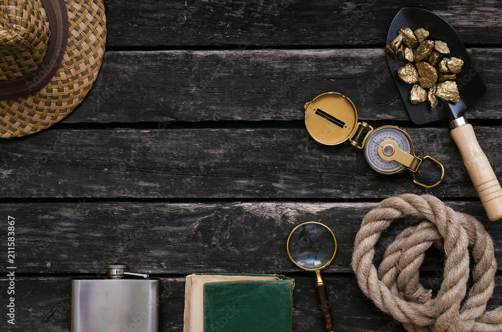 Tourist hat, flask, diary book, shovel full of gold ore, compass, rope ...