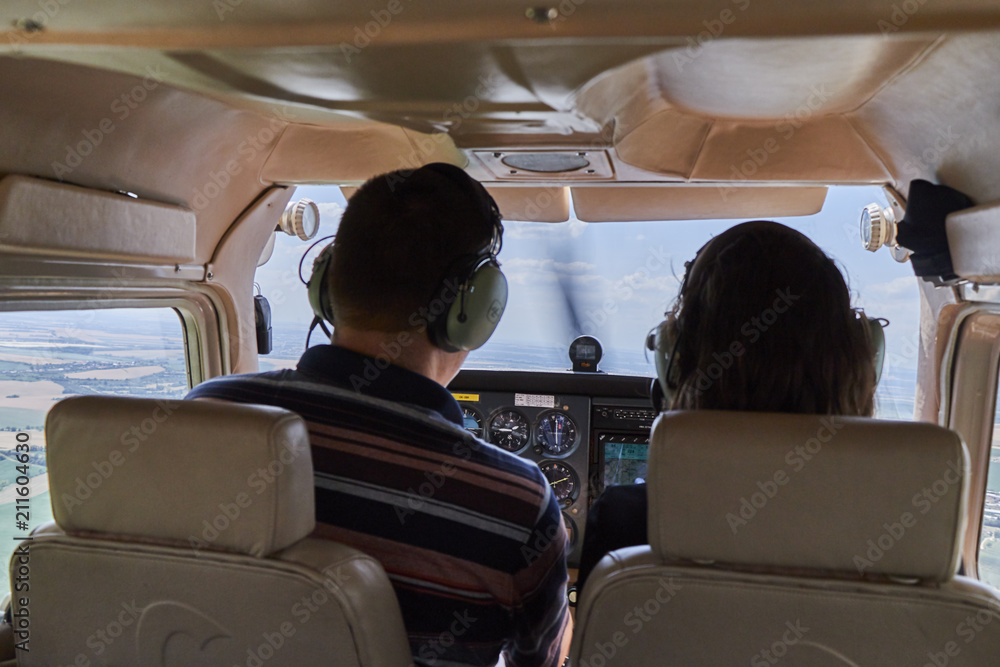 Two pilots sitting in a cockpit of cessna skyhawk 172 airplane. Stock ...