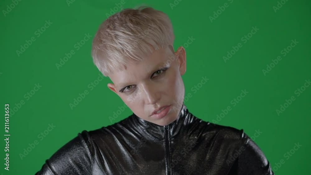 a lady with short hair, like an alien or a space character from a movie ...