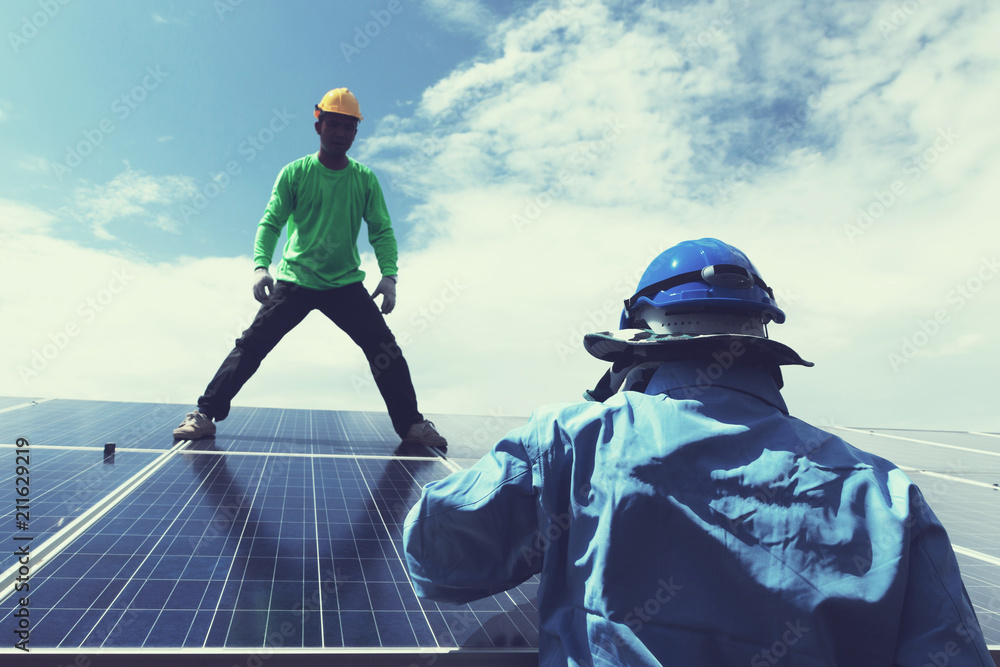 engineer team working on replacement solar panel in solar power plant ...