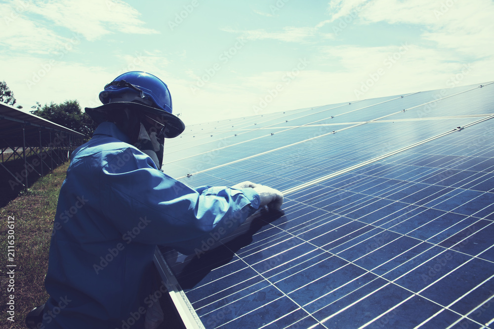 engineer team working on replacement solar panel in solar power plant ...