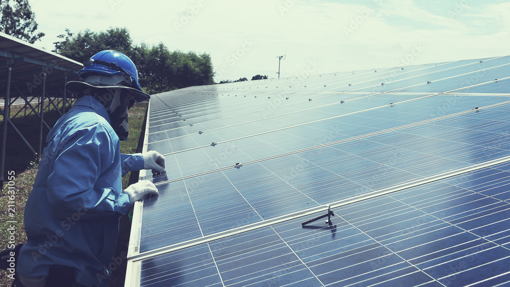 engineer team working on replacement solar panel in solar power plant ...