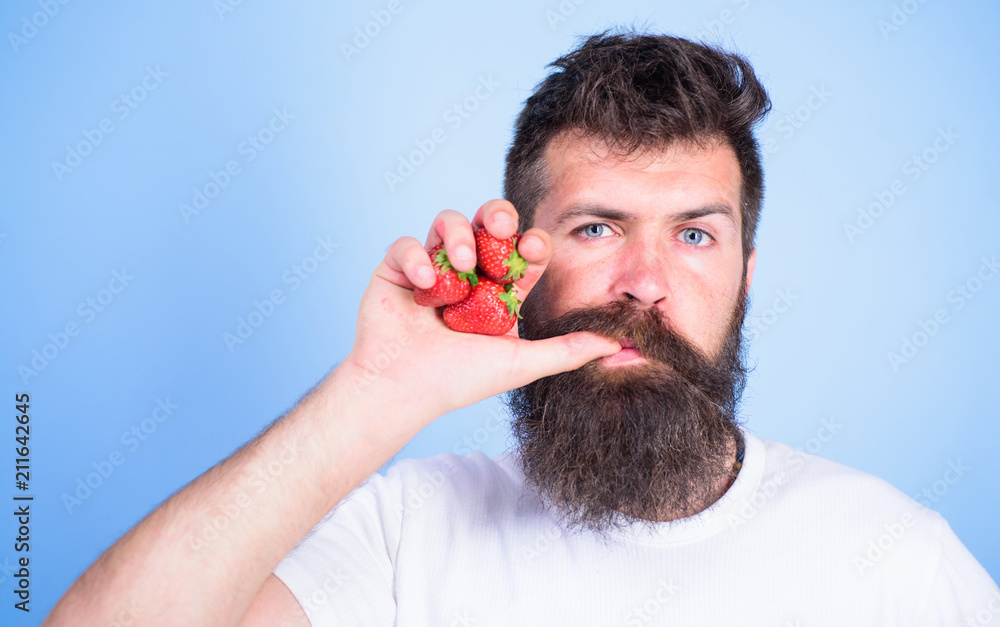 Fresh juice concept. Man drinks strawberry juice suck thumb as drink ...