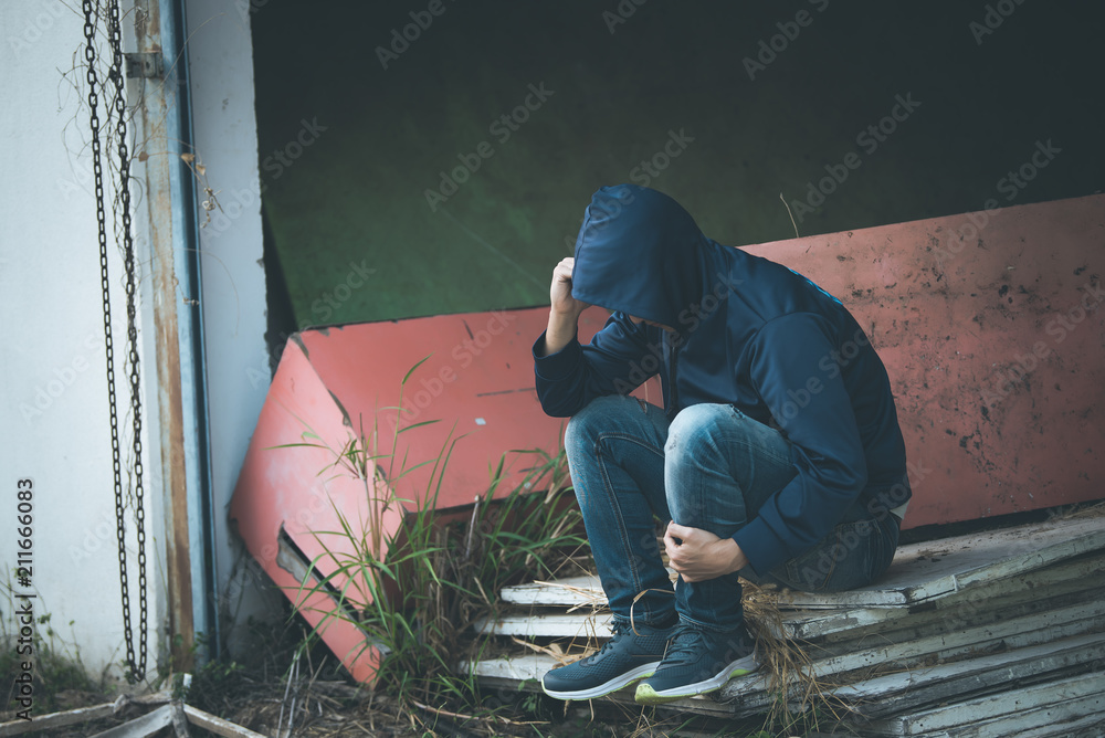 Portrait of asian man sad,drug addict man sitting on the floor,flakka ...
