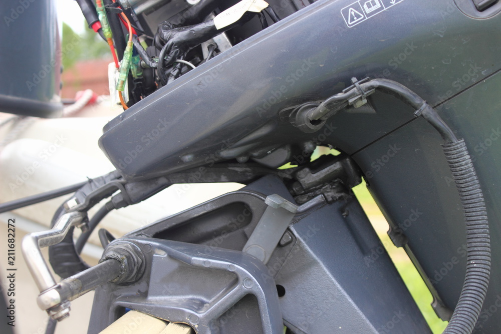 Maintenance and repair of ships - installation of the outboard motor on ...