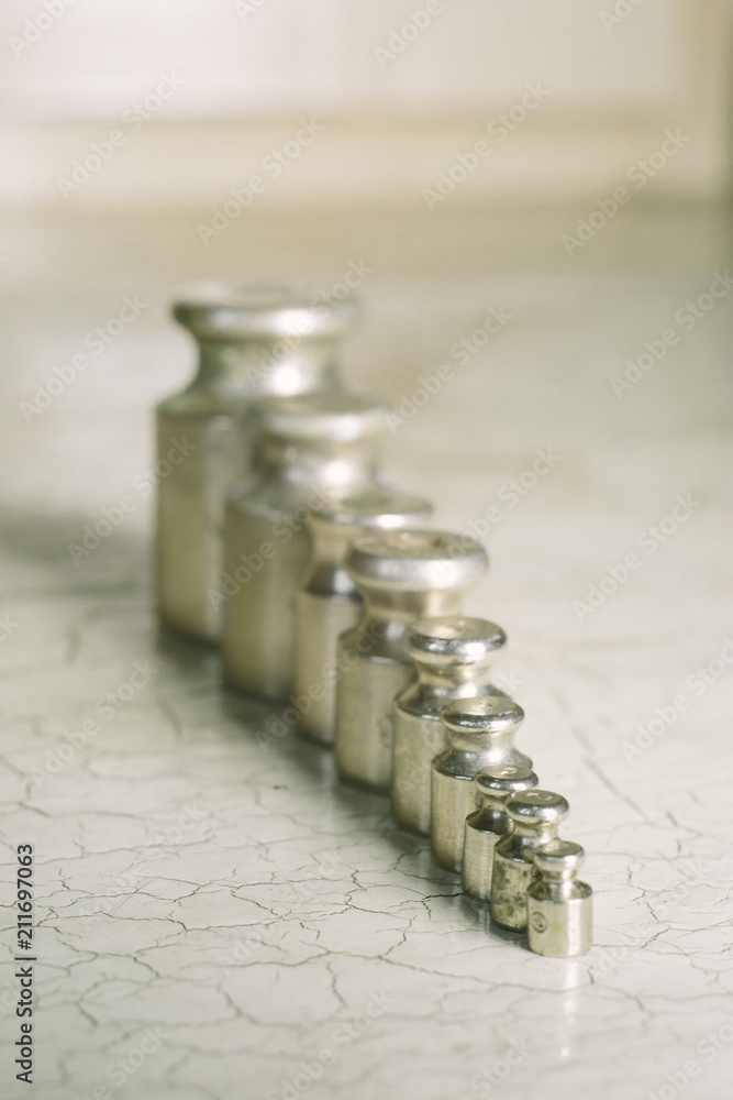 Set of pharmacy laboratory precision weights for a balance scale on an ...