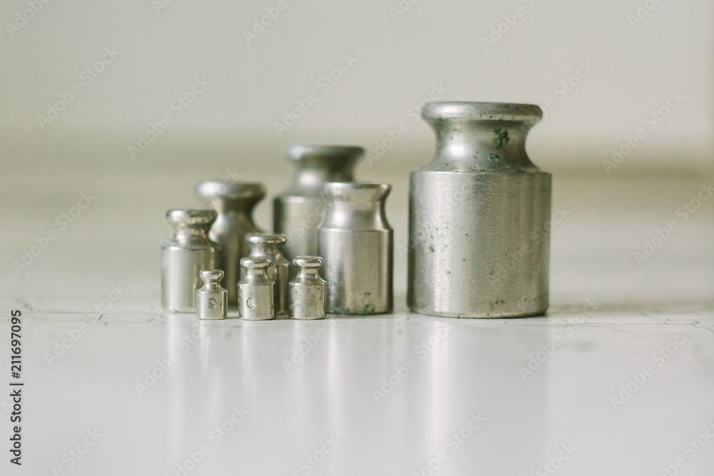 Set of pharmacy laboratory precision weights for a balance scale on an ...