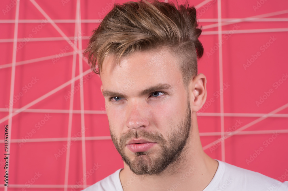 Man with bristle on strict concentrated face, pink background ...