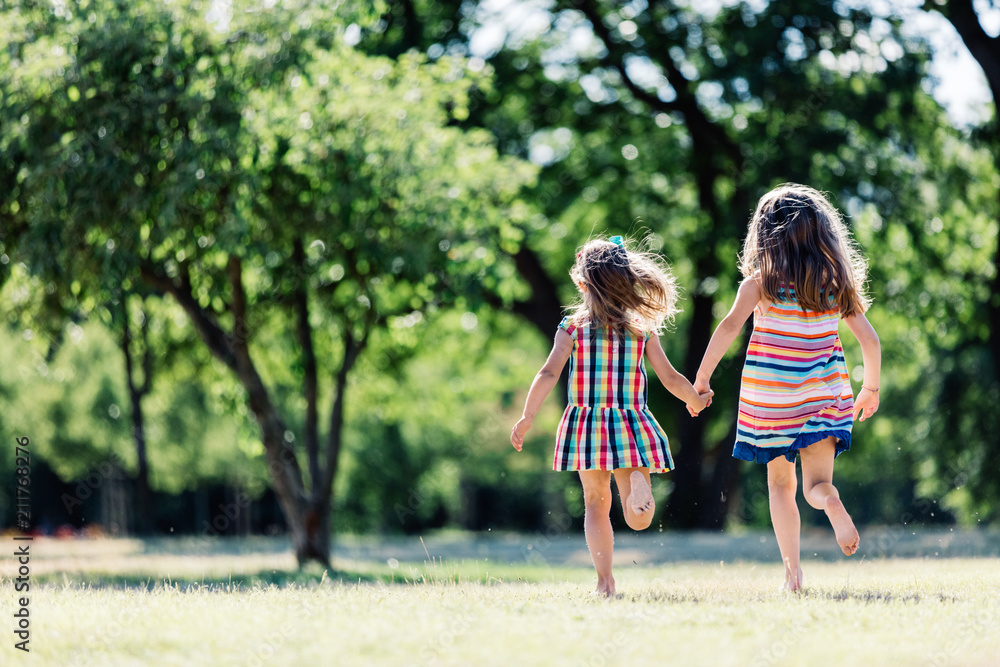 Two Little Girls Running