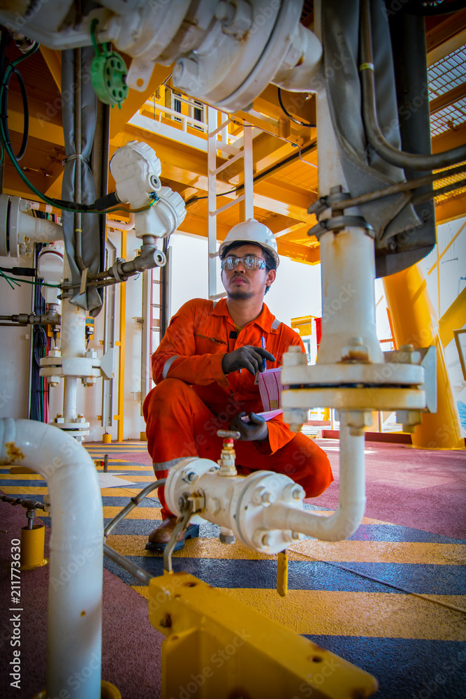 operator recording operation of oil and gas process at oil and rig ...