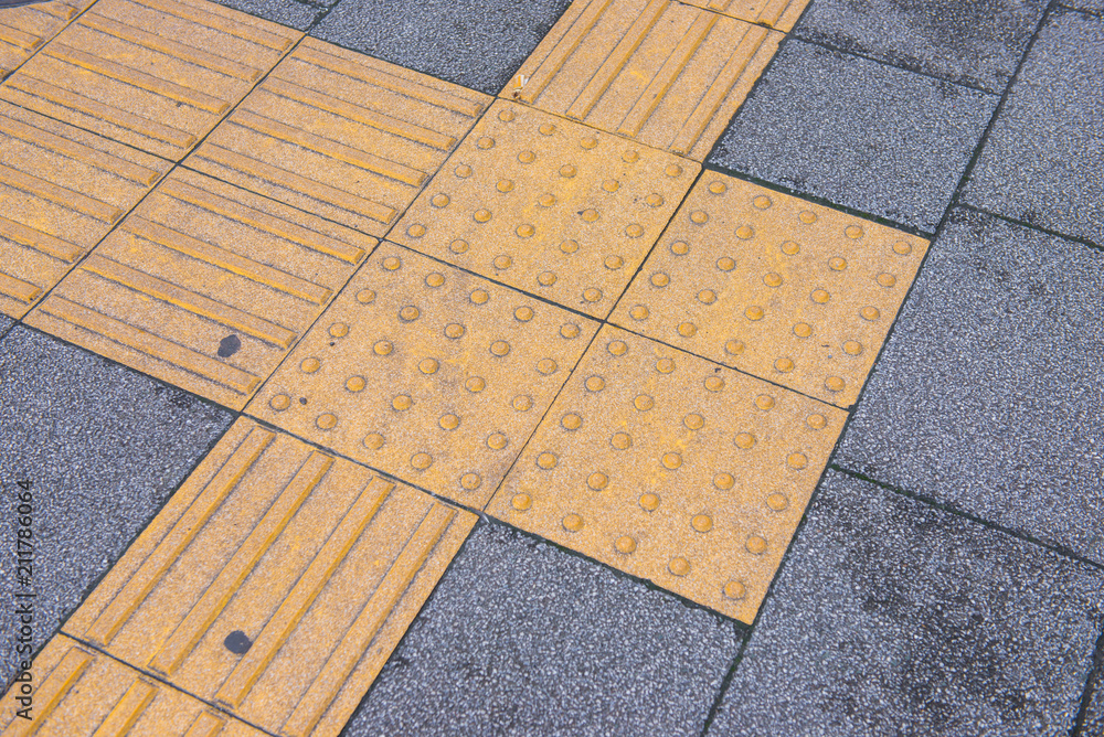 Tactile paving for blind handicap on tiles pathway Stock Photo | Adobe ...
