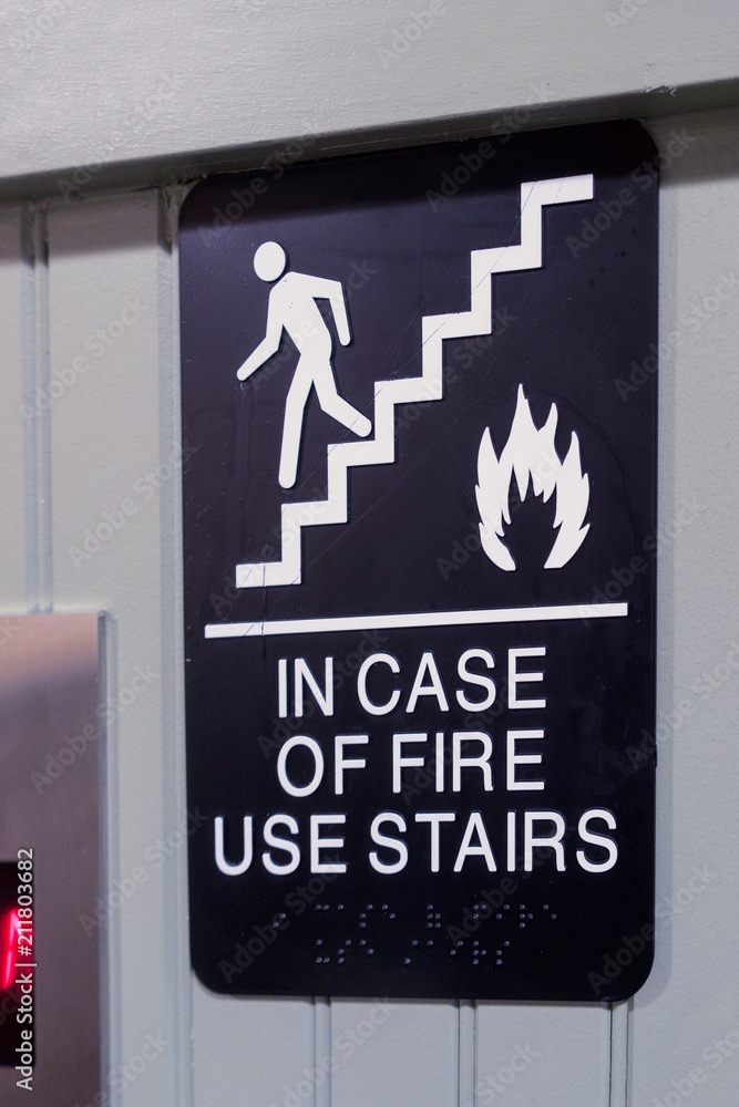 in case of fire use stairs sign with man stairs and fire icon Stock ...