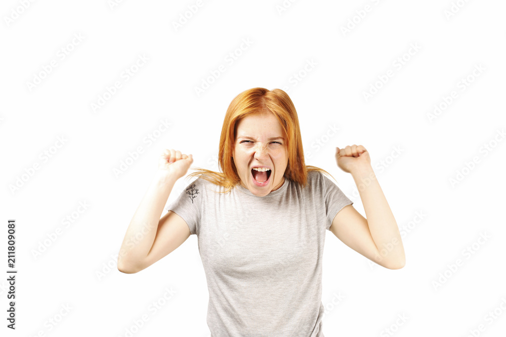 Beautiful young woman, natural redhead with clenched fists up & scary ...