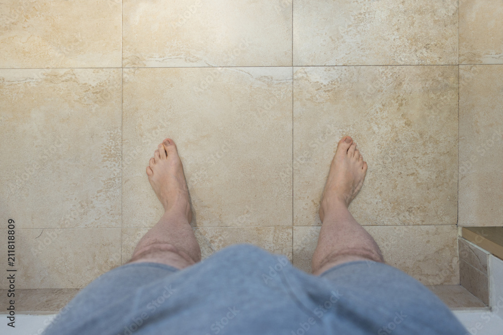 man in grey briefs underpants standing bare feet on tile floor Stock ...