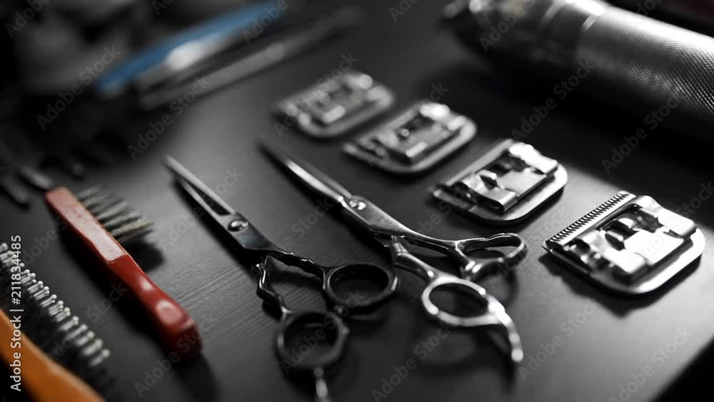 Table with scissors and trimmers at the barber shop, making of haircuts ...