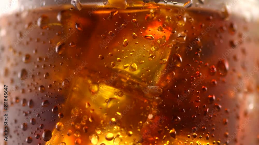 Coke with ice cubes background. Rotation 360 degrees. 4K UHD video ...