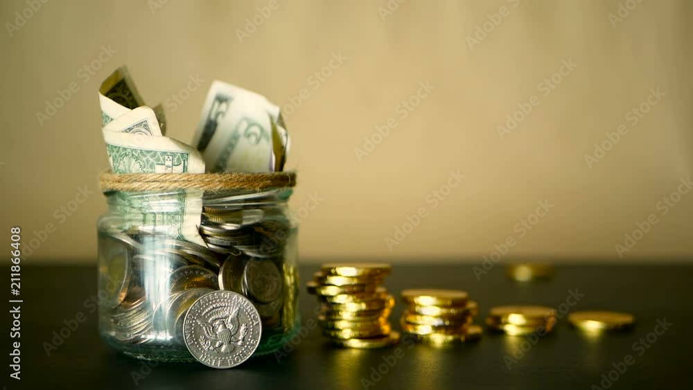 Saving money coin in jar. Symbol of investing, keeping money concept ...