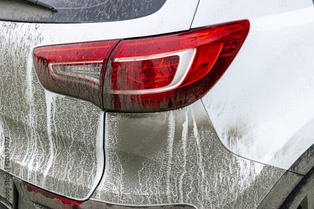 Back view of a very dirty car. Fragment of a dirty SUV. Dirty ...