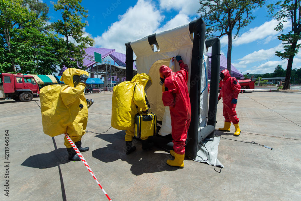 Fireman wear hazmat (hazardous material) suits in hot zone tent Stock ...