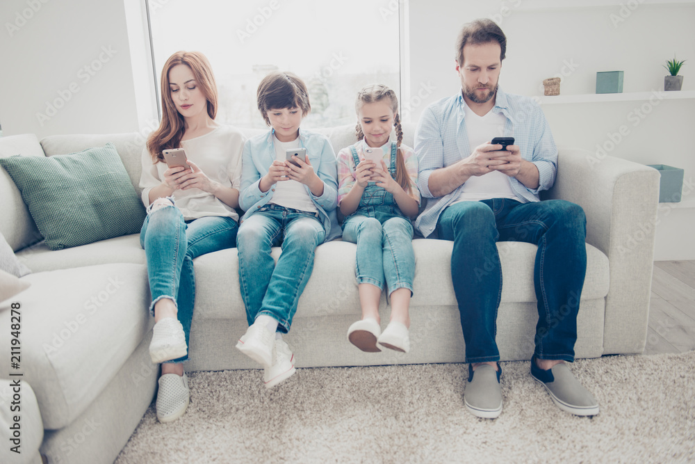 Portrait of family with two kids having holding smart phone electronic ...