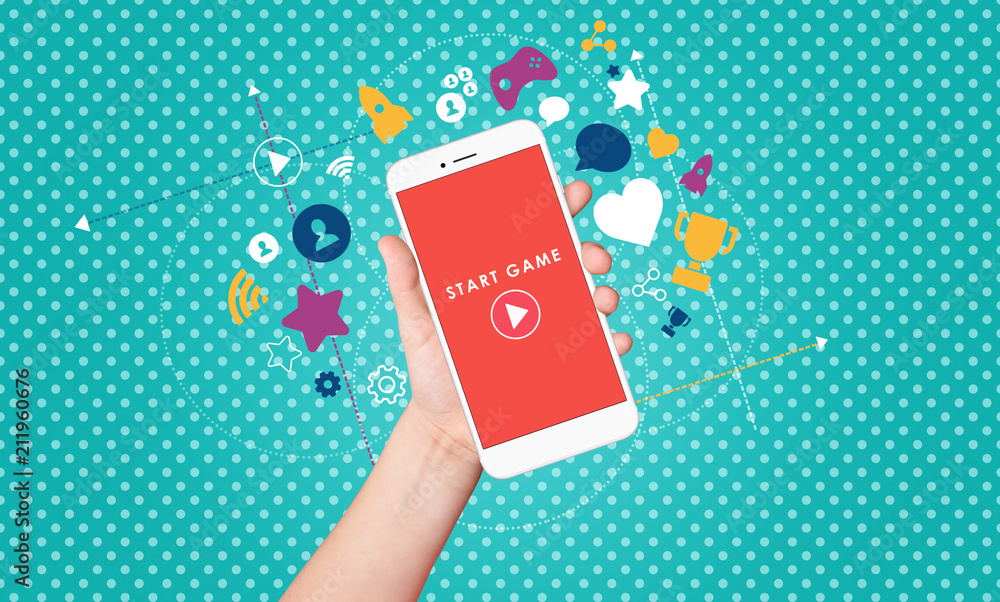 Kid hand holding smartphone with start game button on screen with award ...