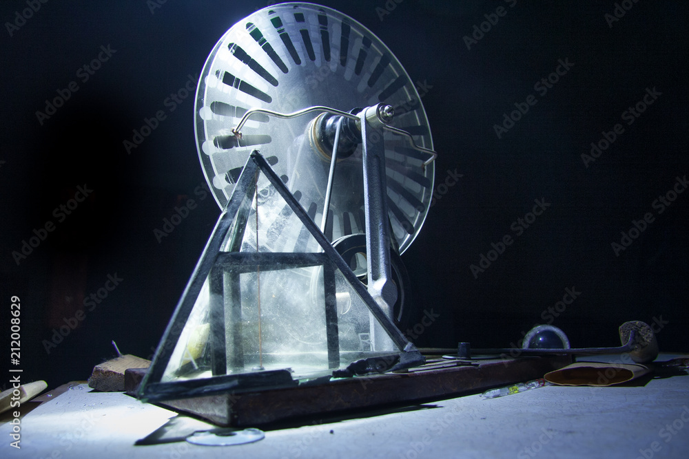 Old electrostatic machine, Wimshurst generator and glass pyramid on ...