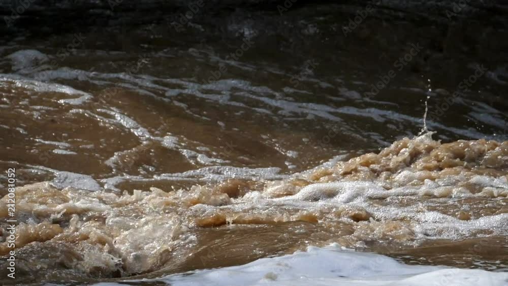 Overflowing river wild waters in slow motion. American Caribbean river in the rain forest ...