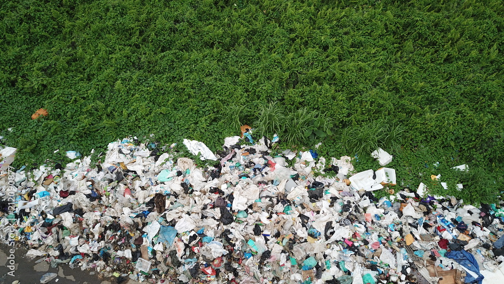 Pollution and poverty. Garbage trash pollutes poor shanty town in ...