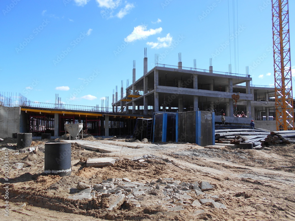 Workers at the construction site, building high-rise buildings. Stock ...