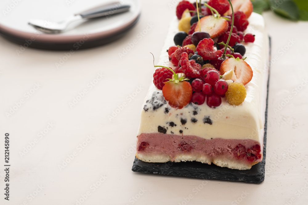 Vanilla and berries ice cream loaf cake, selective focus. Homemade ...