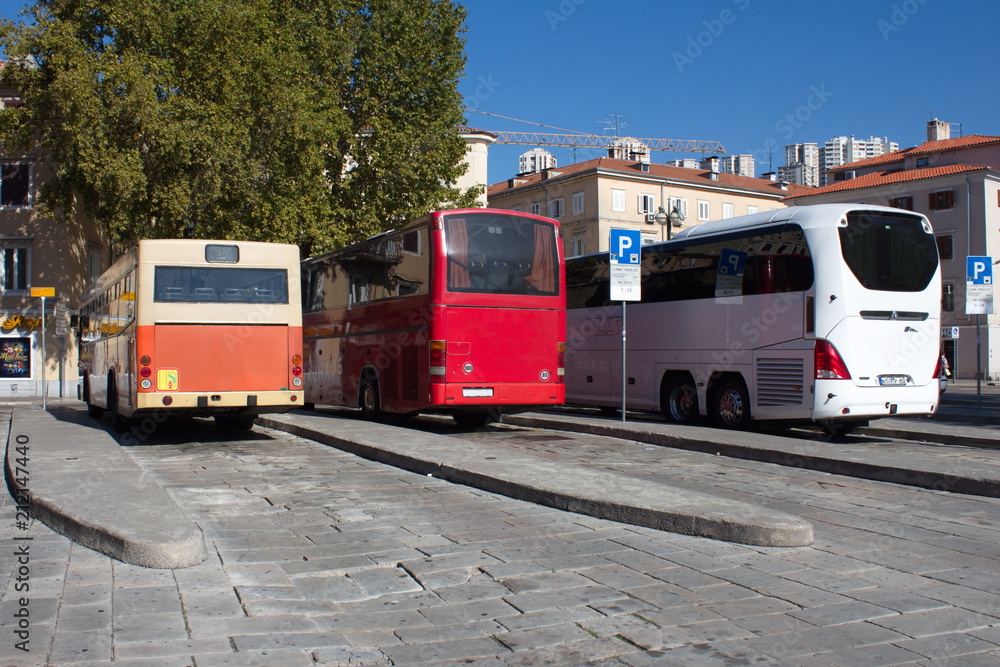 Three generation of buses parked at local bus station, raging from ...