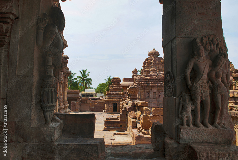 Carved figures dvarapala and the charming mithuna, on the pillars of ...