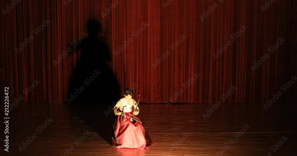 Korean female musician playing the Haegeum which is the Korean ...