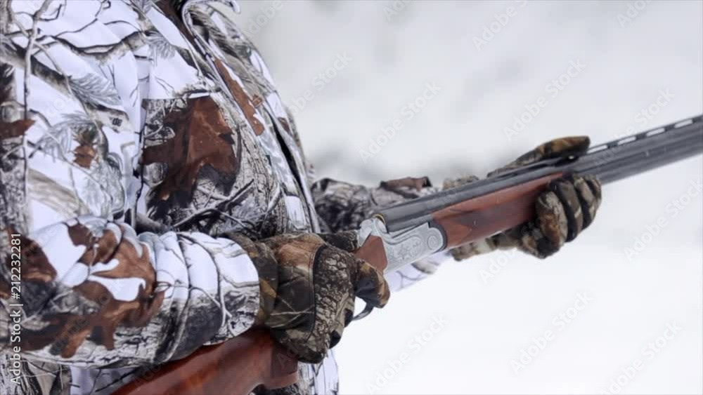 Smoking Gun. Shotgun shells being removed from shotgun with smoke ...
