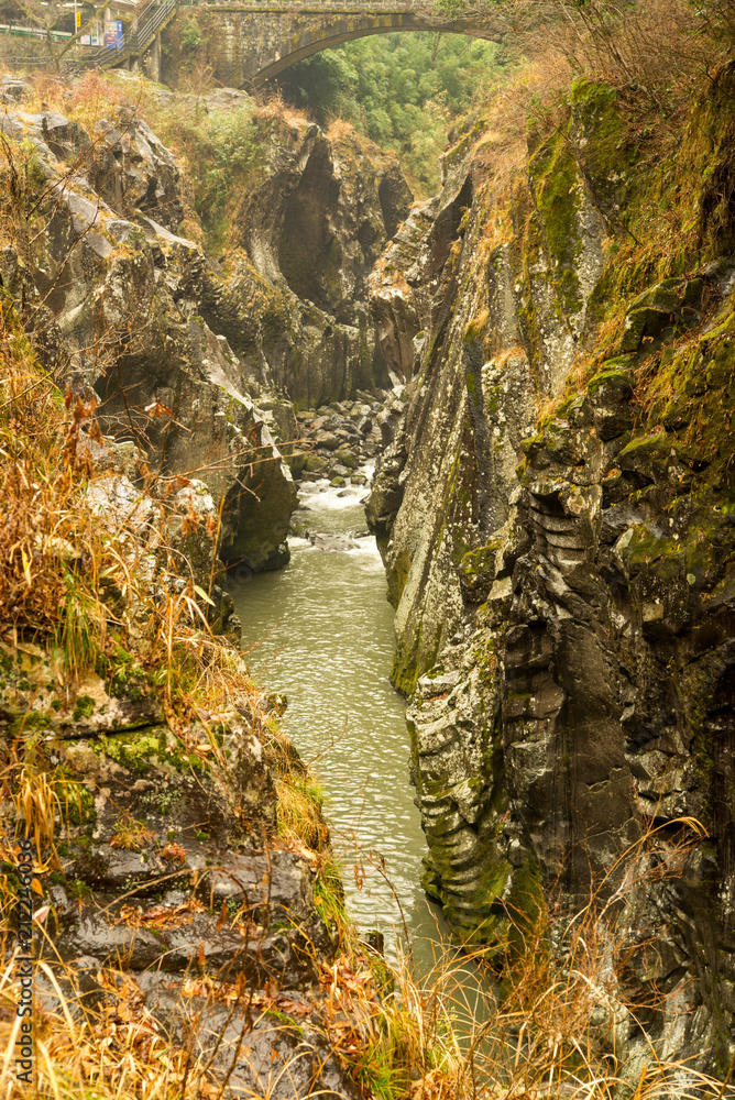 Wide detail of Gokase river rapids running through Takachiho gorge ...