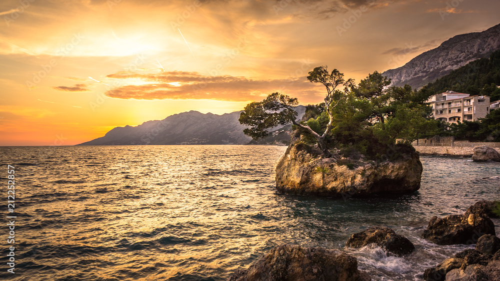 Famous rock near the town of Brela at sunset, Makarska Riviera ...