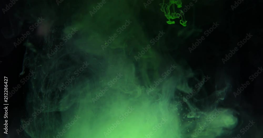 Droplet of green acrylic paint dropped into water isolated on white ...