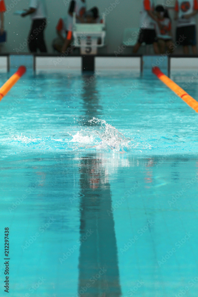Water splash from swimmer in lane no. 5 in swimming pool Stock Photo ...