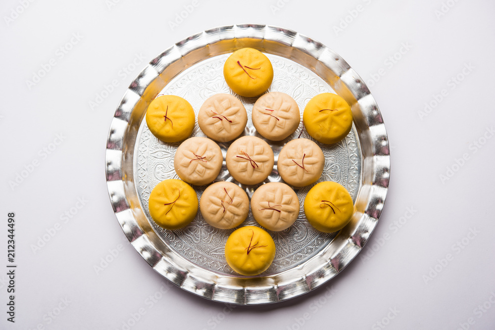 brown and Kesar Pedha or Peda is an Indian traditional sweet dish made ...